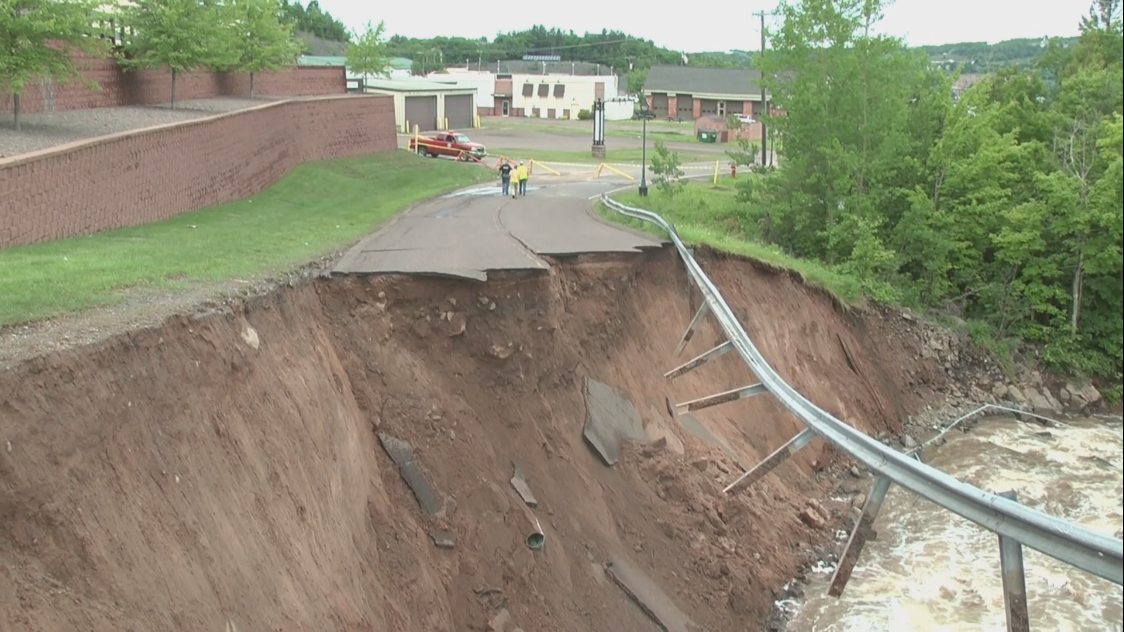 Flash flooding tears up roads in parts of three upper Midwest states