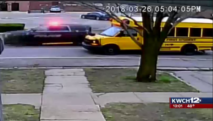 Surveillance video shows WPD officer pass school bus with stop sign out