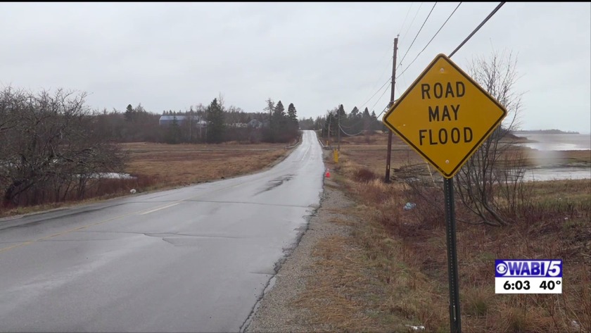 Road May Flood Sign